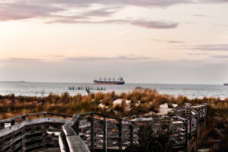 Ship off the shoreline stock image. Image of fence, local - 54114695