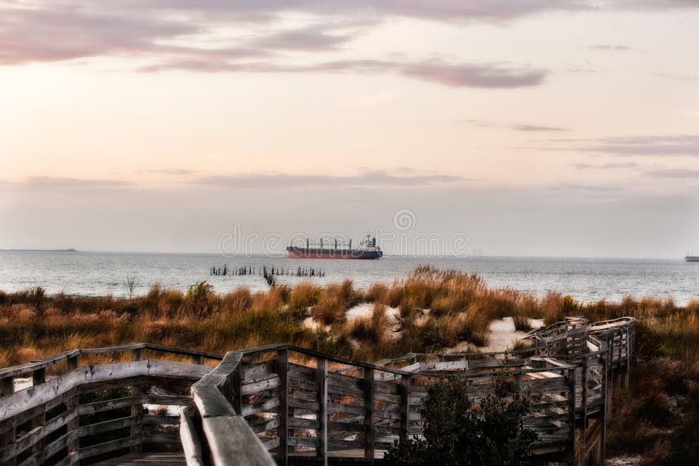 Ship off the shoreline stock image. Image of fence, local - 54114695