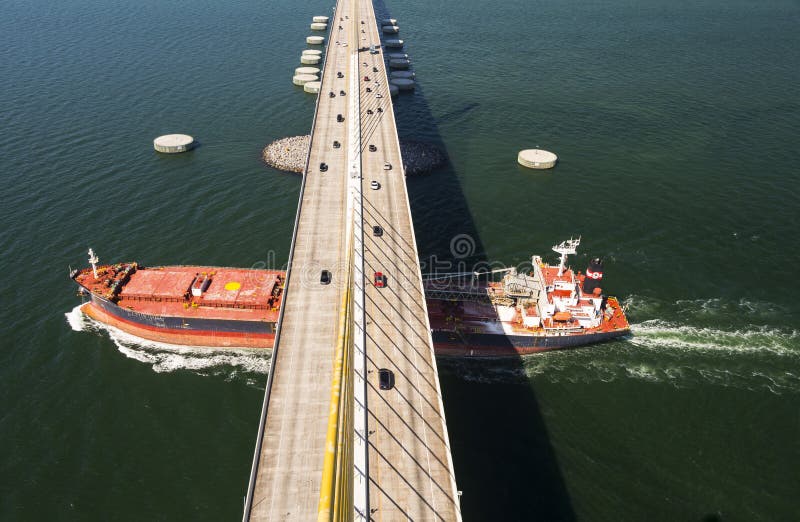 Ship under Bridge editorial stock photo. Image of sunshine - 273047058