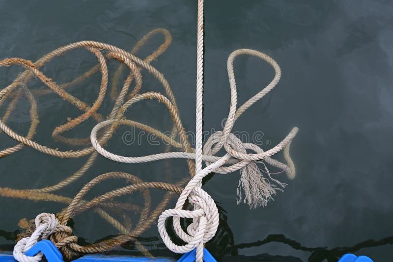 Ship rope knot in water stock photo. Image of loft, pontoon - 186022454