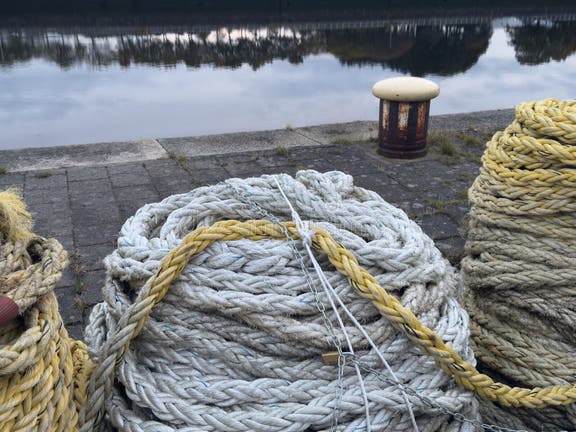 Ship Rope in Roll at Harbour for Secure Mooring of Boat Stock Photo ...