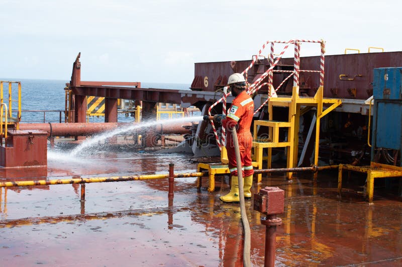 Ship S Crew Hosing Down at Cross Deck of a Cape Size Bulk Carrier for ...