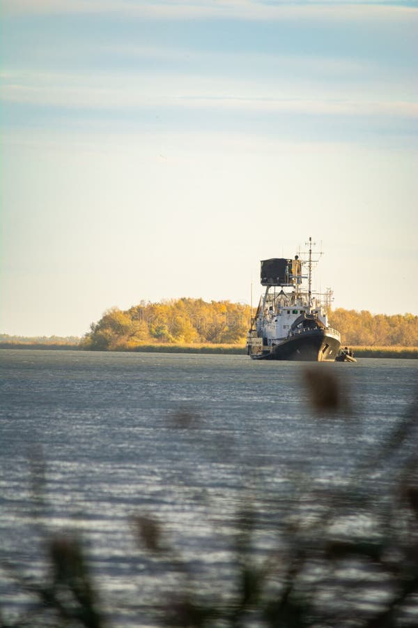 Ship on Water at a Distance from Shore Stock Photo - Image of ship ...