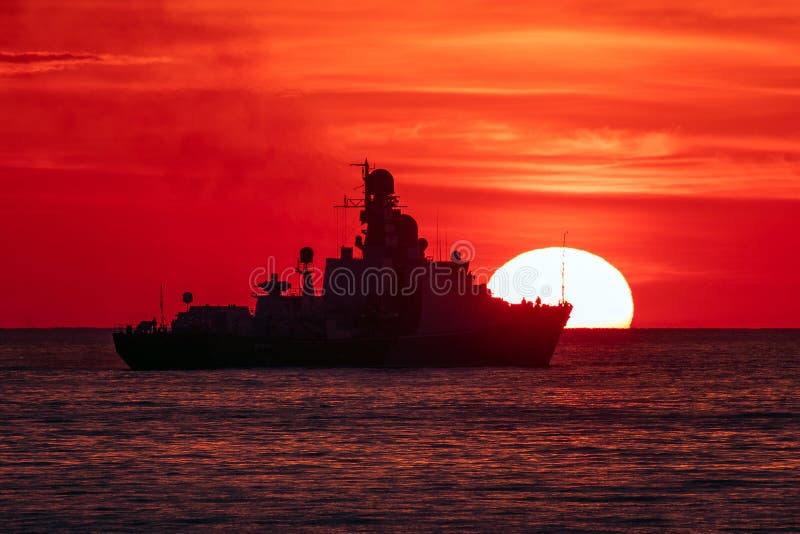 A Ship Sailing Against the Backdrop of a Beautiful Sunset Stock Image ...