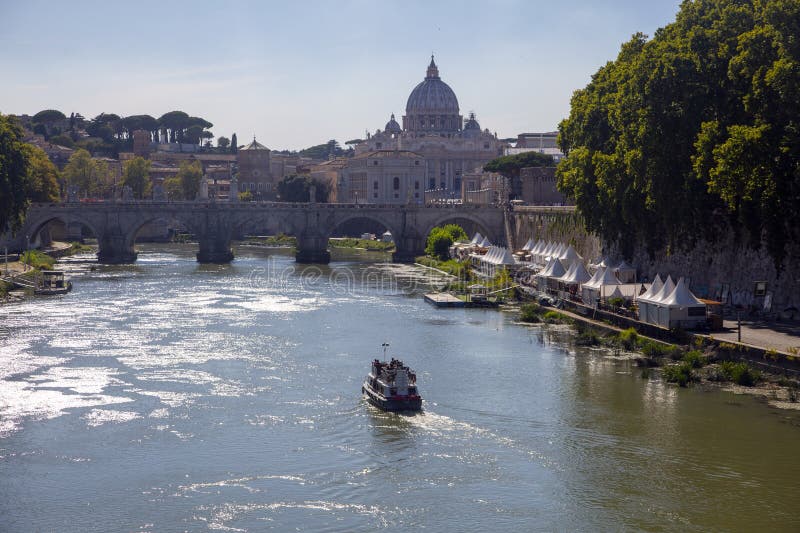 The Ship Sails Down the Tiber River with a View of the Bridge and the ...