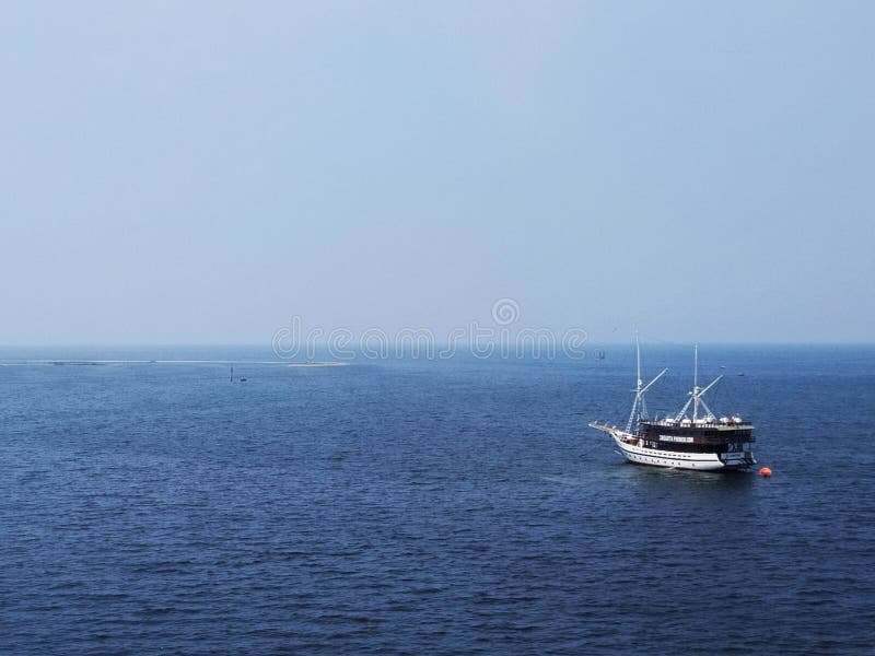 A Ship Sails in the Middle of the Blue Sea Editorial Photo - Image of ...