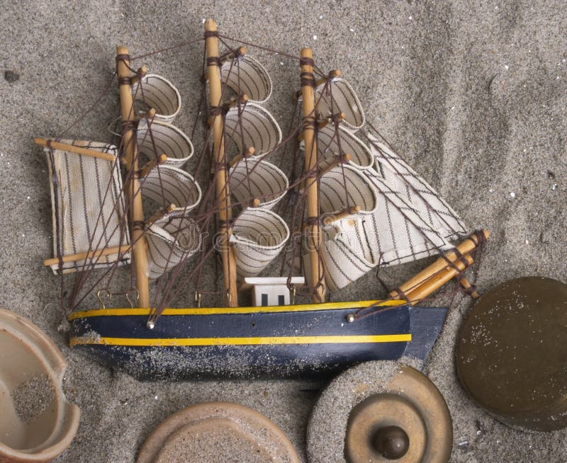 Ship and sails in the sand stock photo. Image of dish - 9487306