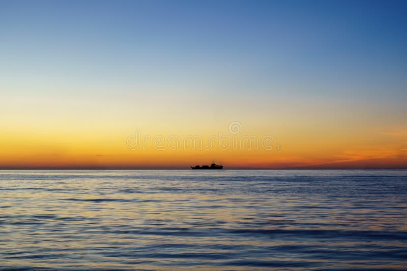 Ship Silhouette Far Away at the Sea during Sunset. Stock Photo - Image ...