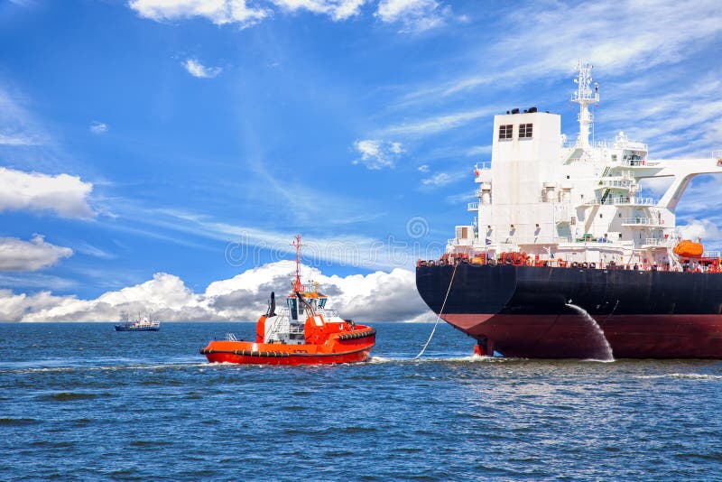 Ship with tug stock photo. Image of escorting, blue - 140902954