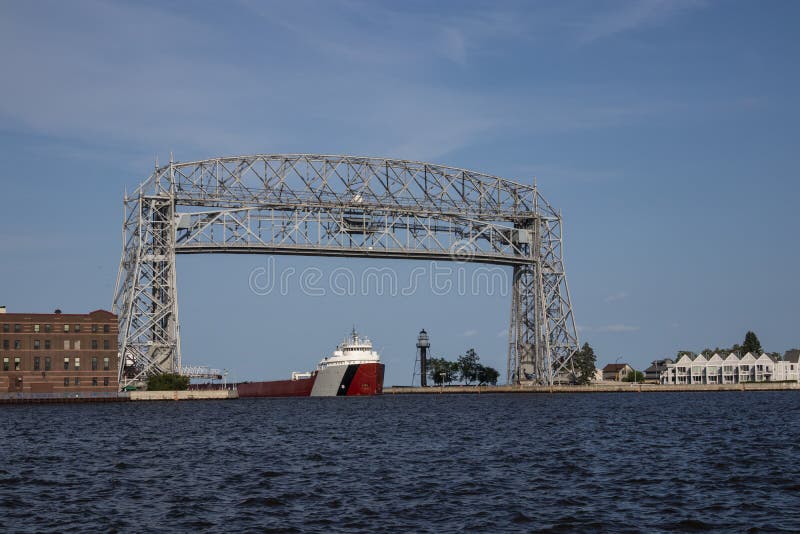 A Ship Under a Lift Bridge stock photo. Image of industrial - 158332526
