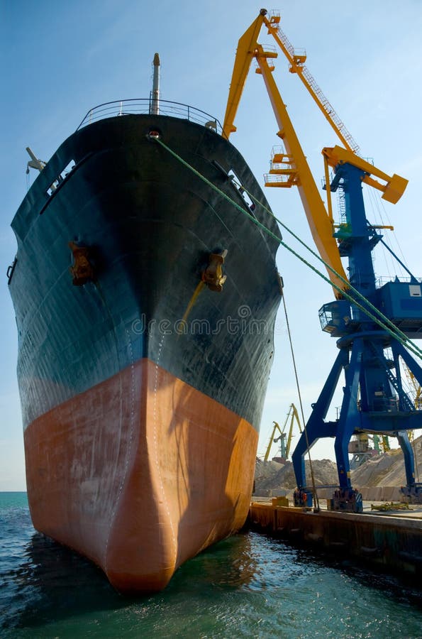 Ship under loading stock image. Image of vessel, water - 8931739