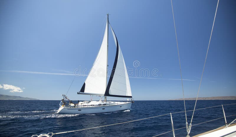 Ship Yachts with White Sails in the Open Sea. Stock Photo - Image of ...