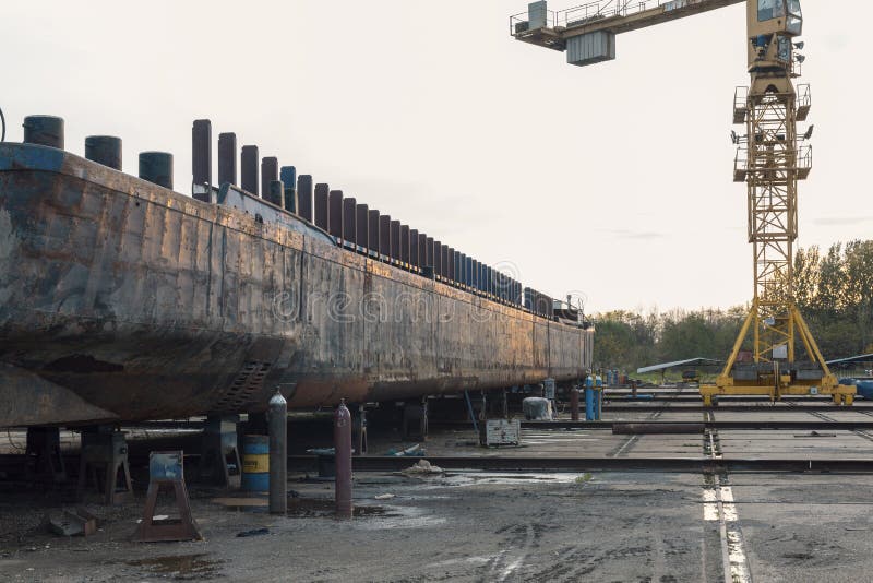 Ship yard with rusty ship stock image. Image of transportation - 165387773