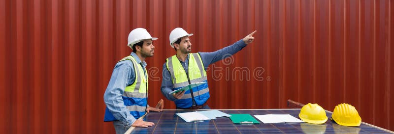 Shipment Worker Pointing at Container Storage Location, Explain To ...