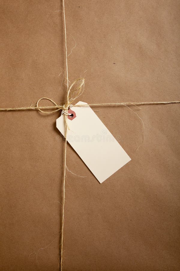 A Shipping Box Ties with String with a Blank Label Stock Photo - Image ...