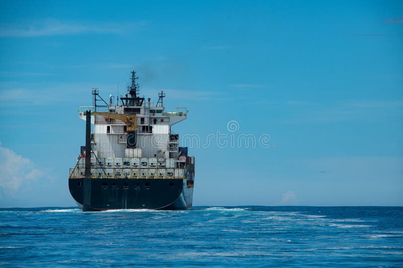Shipping Container on a Blue Ocean with Blue Skies Stock Image - Image ...