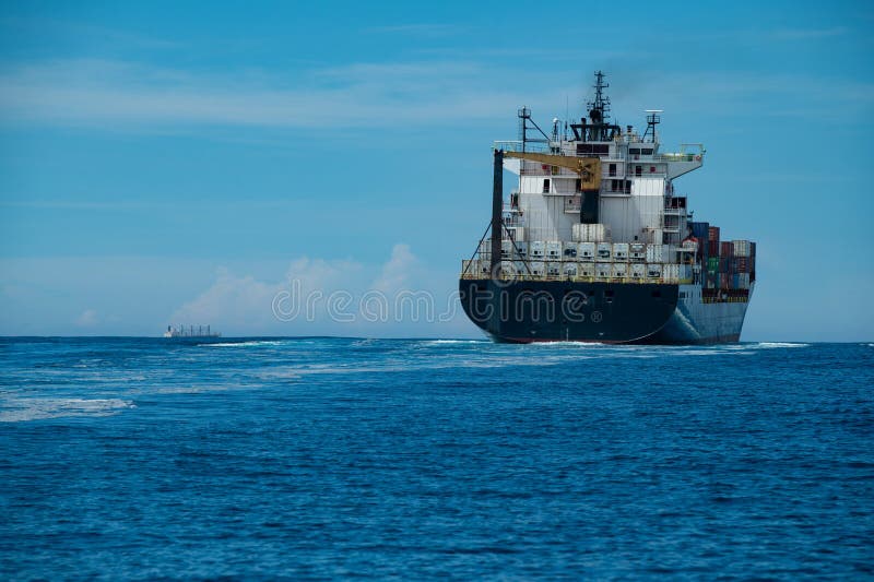 Shipping Container on a Blue Ocean with Blue Skies Stock Photo - Image ...