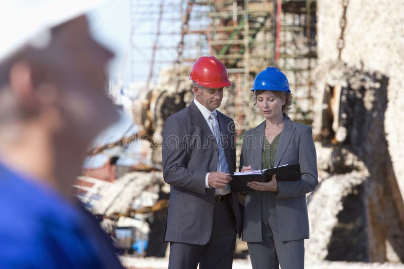 A Shipping Engineer with Co-workers Stock Image - Image of equipment ...