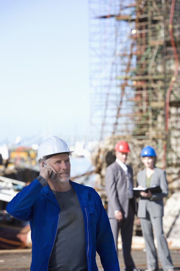 A Shipping Engineer Talking on Phone Stock Image - Image of control ...