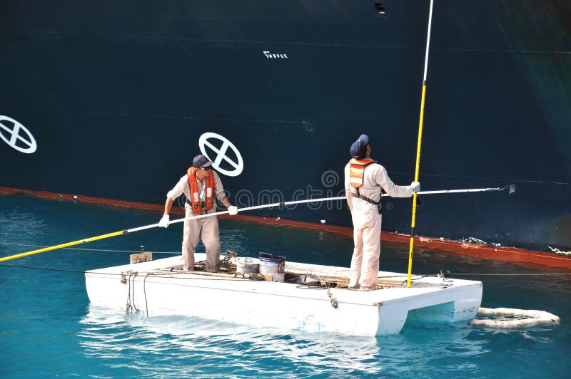 Group of Men in Overalls Painting Boat. Stock Photo - Image of goggle ...