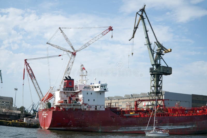 Ships Load and Unload Cargo in the Port of Gdansk. Poland Editorial ...
