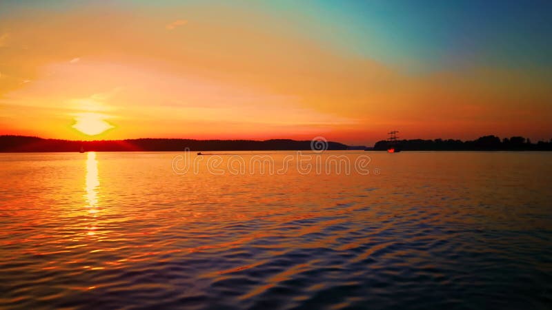 Ships and Yachts in the Waters at Sunset. Yellow Sunlight and Blue Sky ...