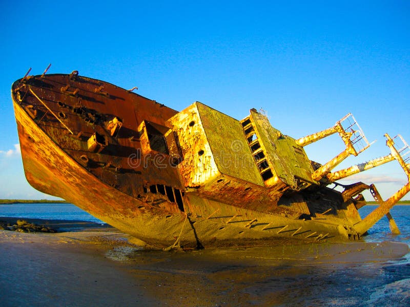 Shipwreck on a beach stock photo. Image of shore, deserted - 97048170