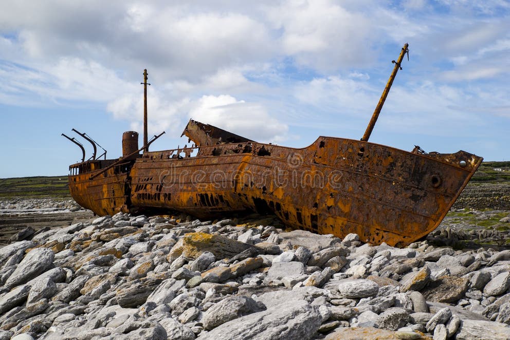 Shipwreck on the Rocks stock photo. Image of beach, ship - 99644346