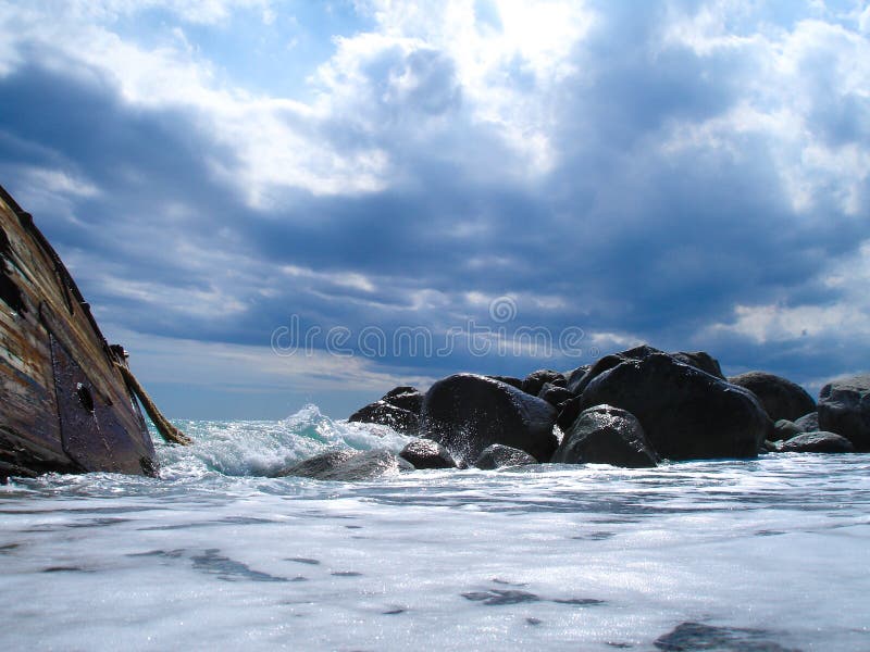 Shipwreck of a Sailing Ship after a Storm with Blue Sky. Stock Photo ...
