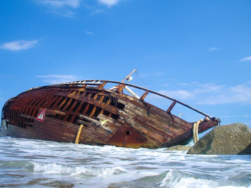 Shipwreck of a Sailing Ship after a Storm with Blue Sky. Stock Photo ...