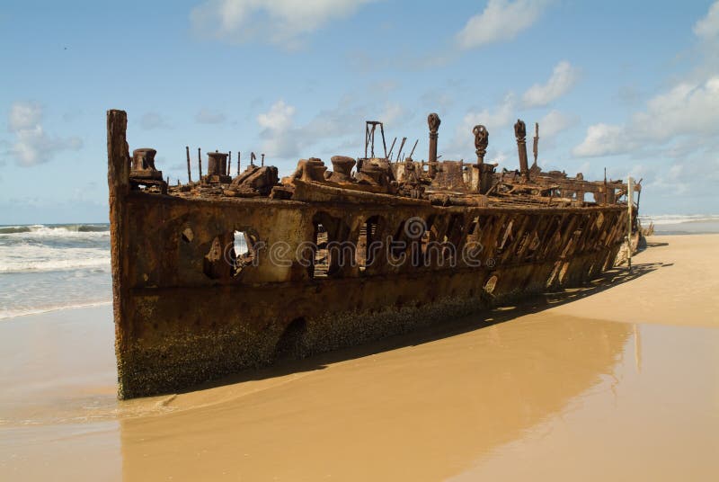 Shipwrecked on the beach stock photo. Image of orange - 7081362