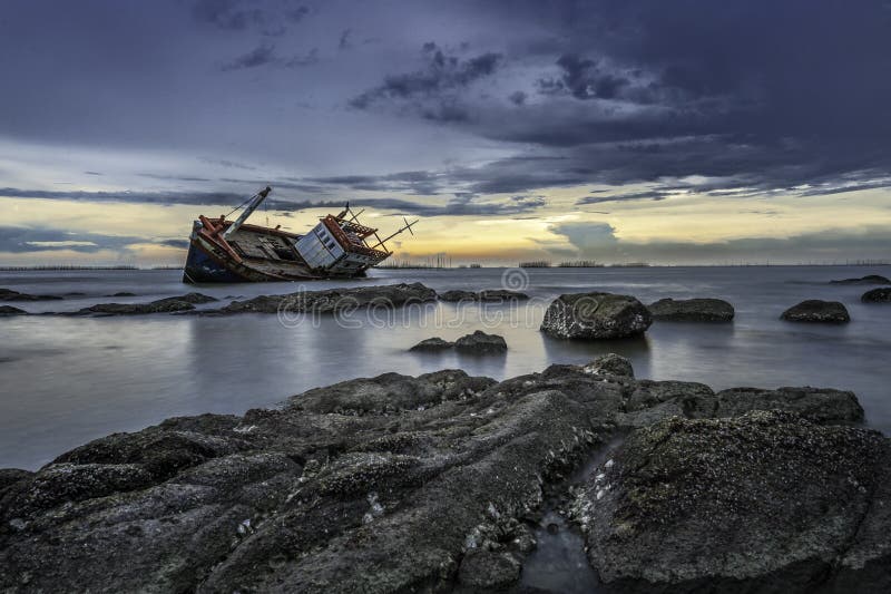 Shipwrecked stock photo. Image of dusk, ship, accident - 41255326