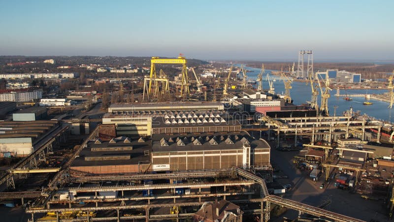 Shipyard Aerial View: Cranes, Ships and Industrial Scene at Sunset ...