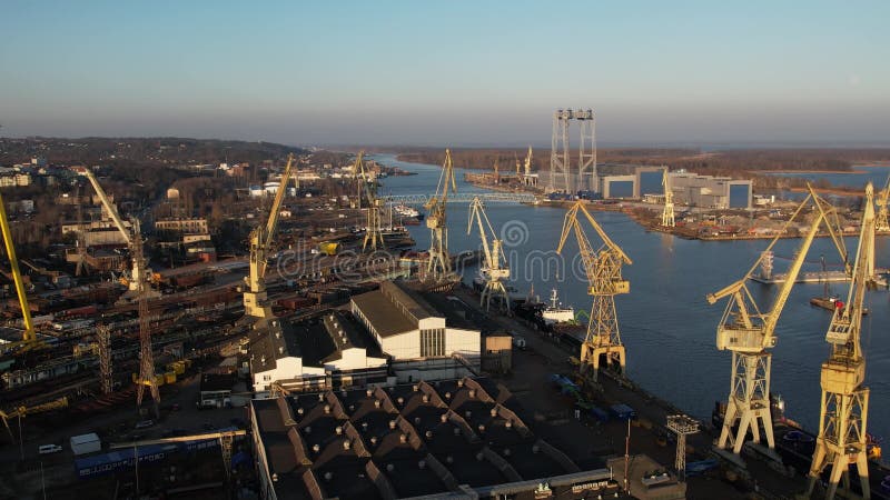 Shipyard Aerial View: Cranes, Ships and Industrial Scene at Sunset ...
