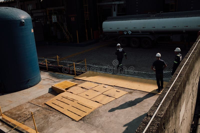 Shipyard Construction Workers Wearing Safety Helmets and Standing on a ...