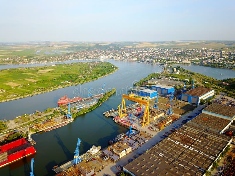Industrial Cargo Port with Operating Cranes on the Danube River Stock ...