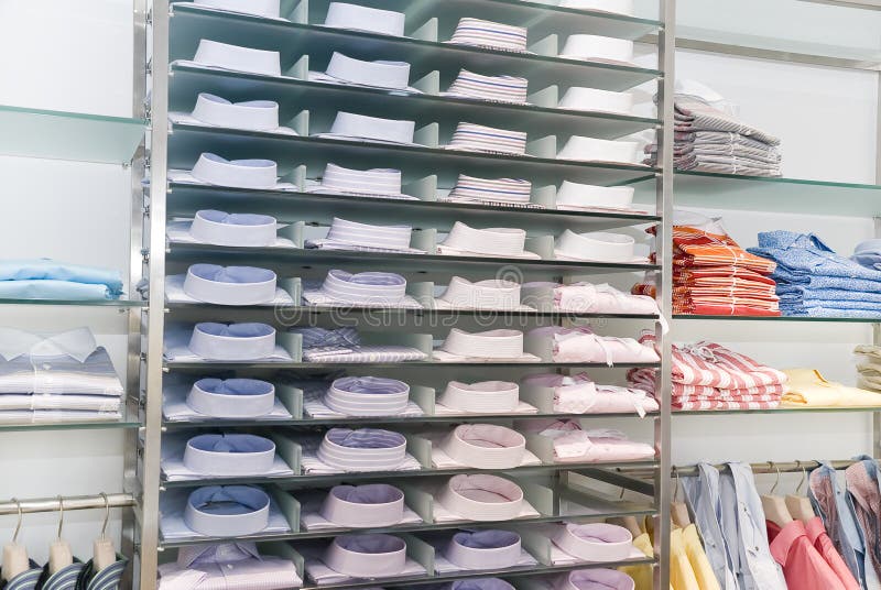 Shelf with shirts in store stock image. Image of close - 13767685