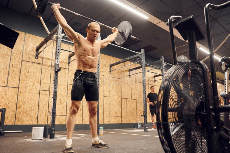 Without Shirt. Strong Man is Lifting Barbell in the Gym Stock Image ...