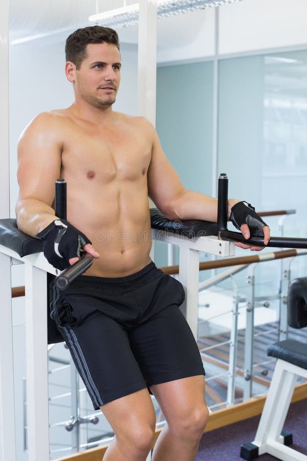 Shirtless Bodybuilder Doing Leg Lifts Stock Image - Image of side ...