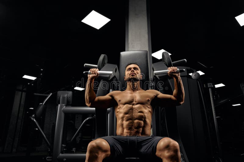 Shirtless Caucasian Bodybuilder Training Back on Simulator. Stock Image ...