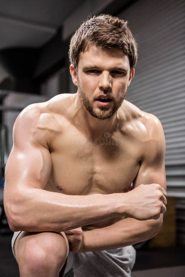 Shirtless man crouching stock photo. Image of muscular - 66929864