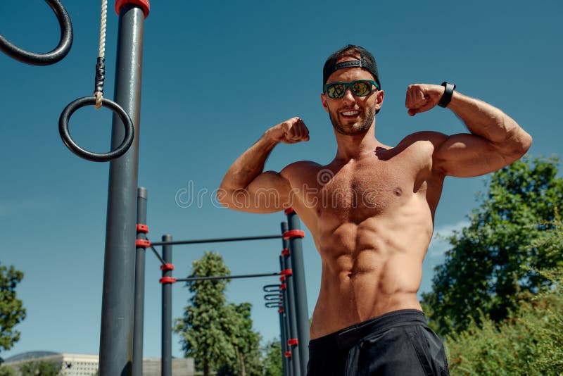 Shirtless Man Doing Loop Exercises Outdoors in Summer Park. Stock Image ...