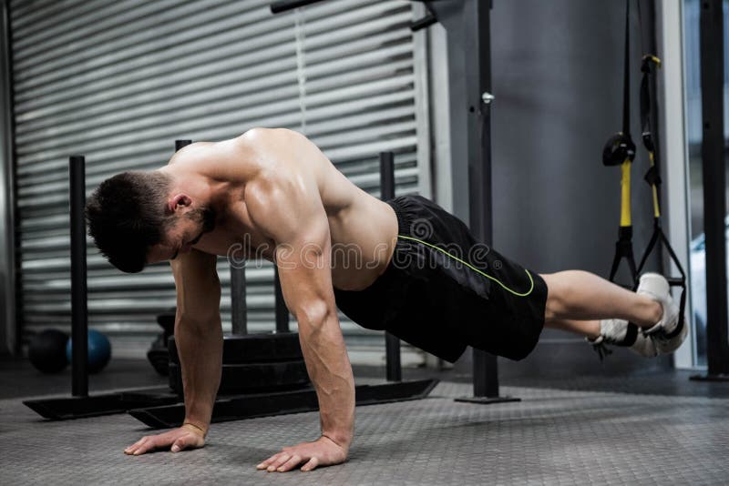 Shirtless Man Doing Push Up with the Rope Stock Photo - Image of ...