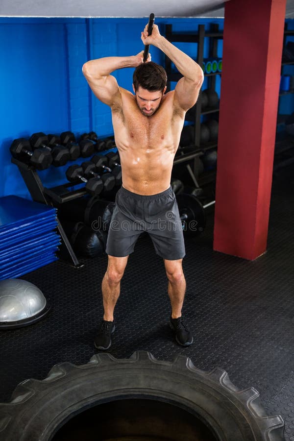Shirtless Man Doing Sledgehammer Exercise Stock Image - Image of adult ...