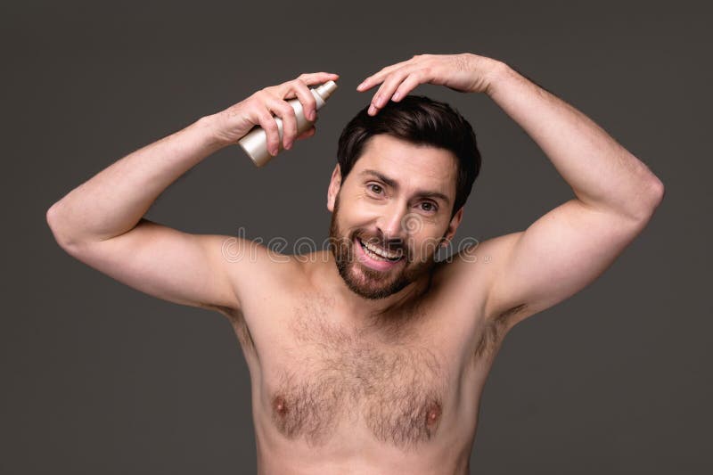 Shirtless Man Using Hairspray and Smiling Camera Isolated on Grey ...