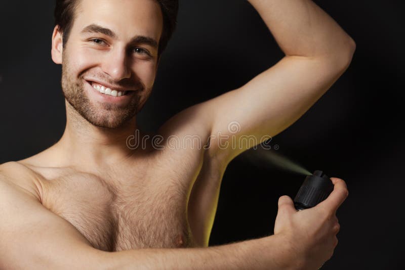 Shirtless White Man Smiling while Using Deodorant Spray Stock Image ...