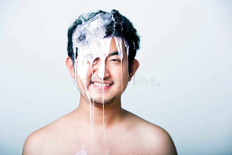 Shirtless Young Man with Pink Paint Falling on His Head Against Gray ...