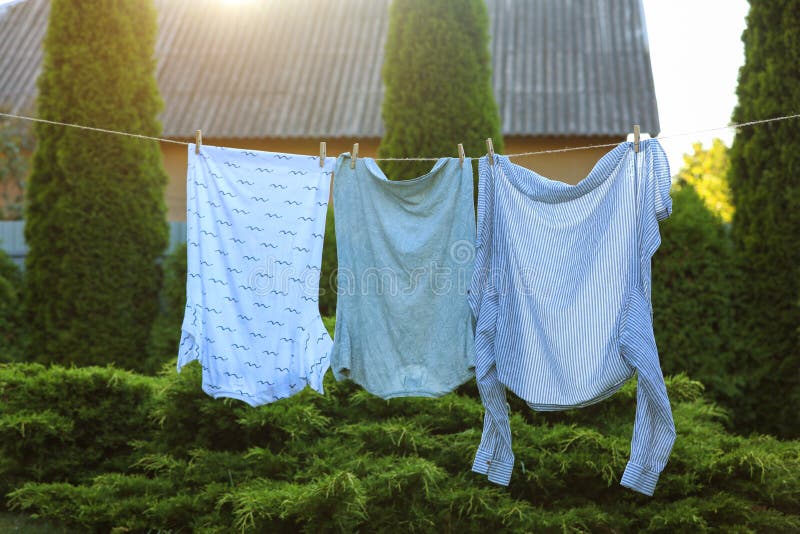Shirts Drying on Washing Line at Backyard of House Stock Photo - Image ...