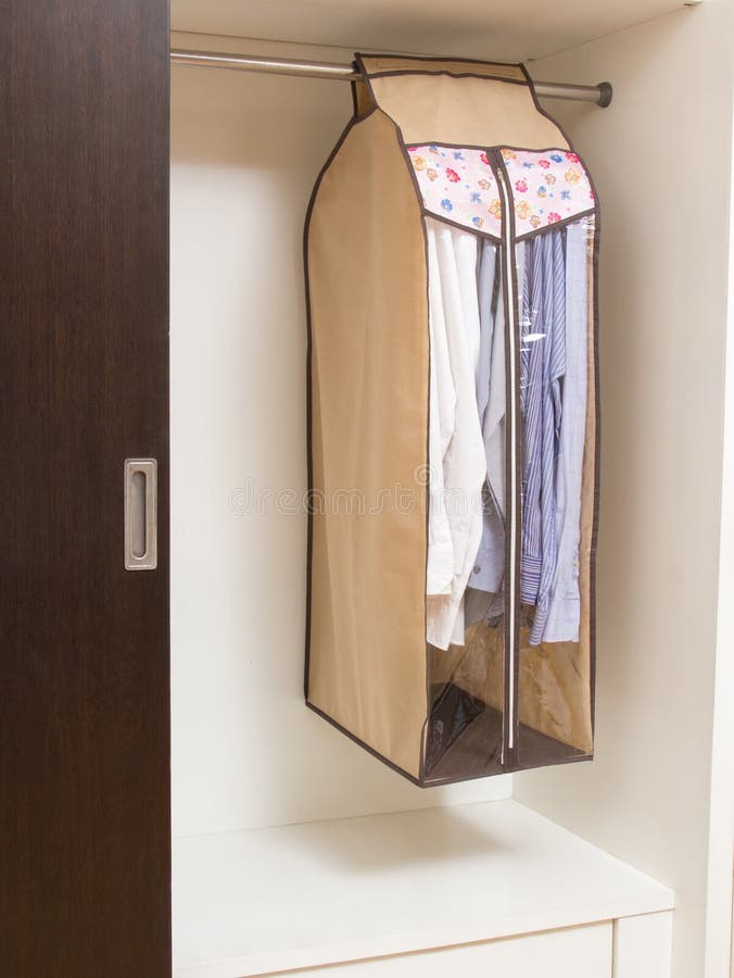 Shirts in Storage Clothes Cover Bag Hanging in Closet Stock Image ...