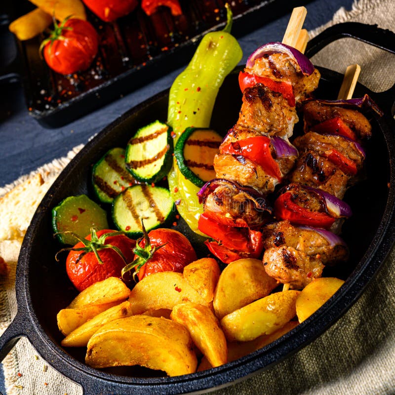 Shish Kebab with Various Vegetables and Spice Country Potatoes Stock ...